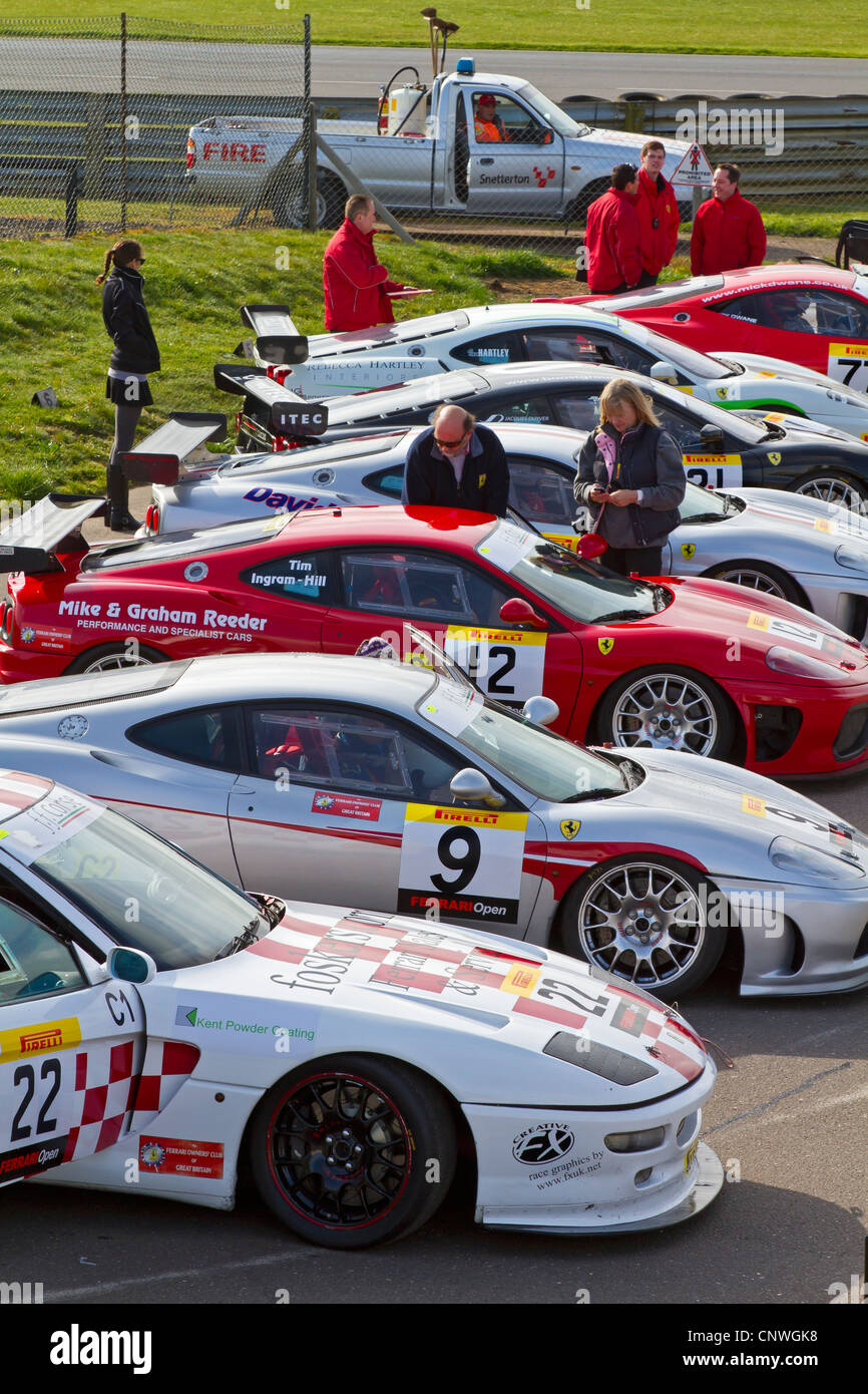 Cars gathered in the holding paddock for the Pirelli Ferrari Open race ...