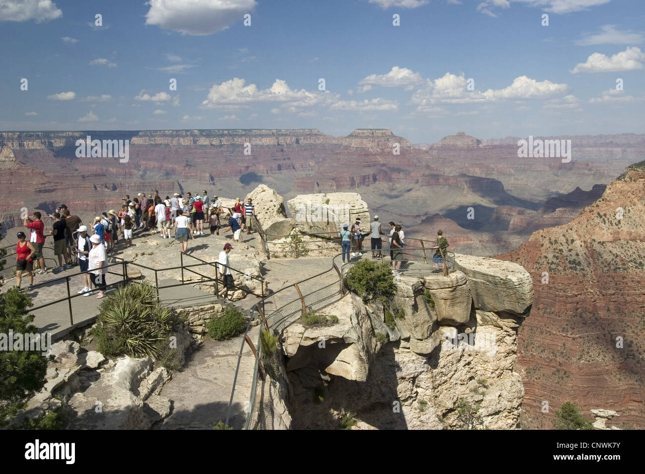 panoramic view of the Grand Canyon, tourists at the the Desert View ...