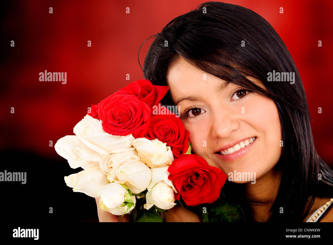 beautiful girl smiling with red and white roses Stock Photo - Alamy