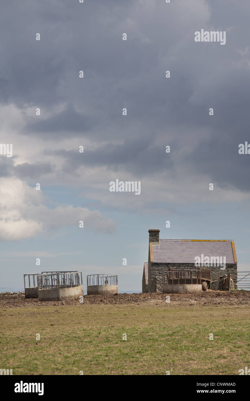 Old Anglesey farm buildings set against a dramatic dark sky Stock Photo ...