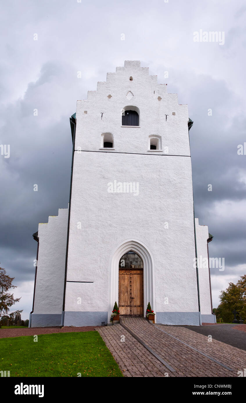 An image of an old white church in the swedish village of Ekeby Stock ...