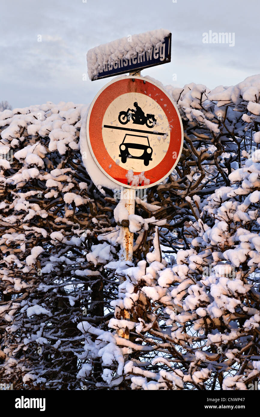 Traffic and street sign covered in snow, Chiemgau Upper Bavaria Germany ...