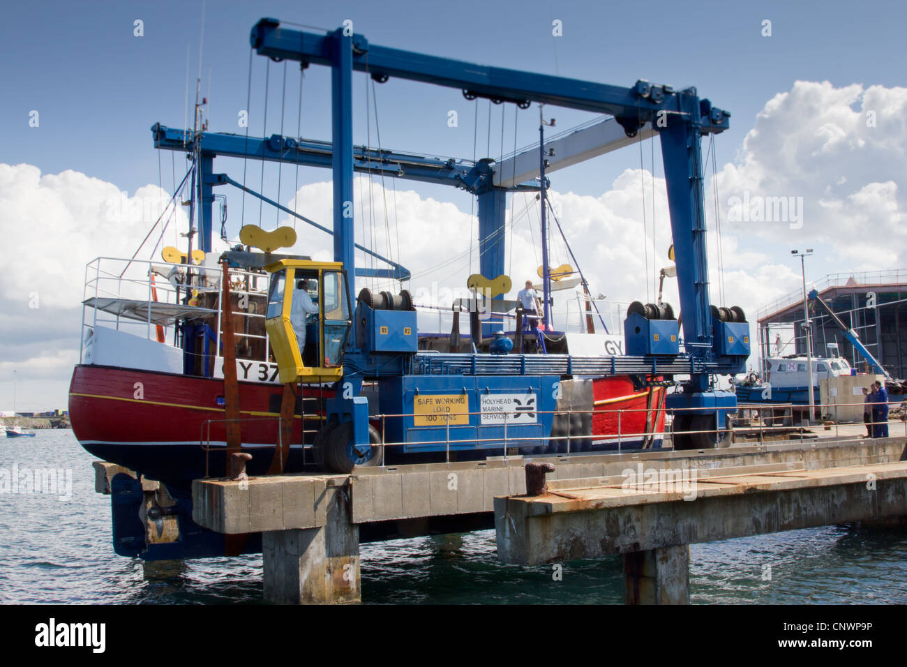 Launching the boat Sarah at Holyhead harbour Stock Photo - Alamy