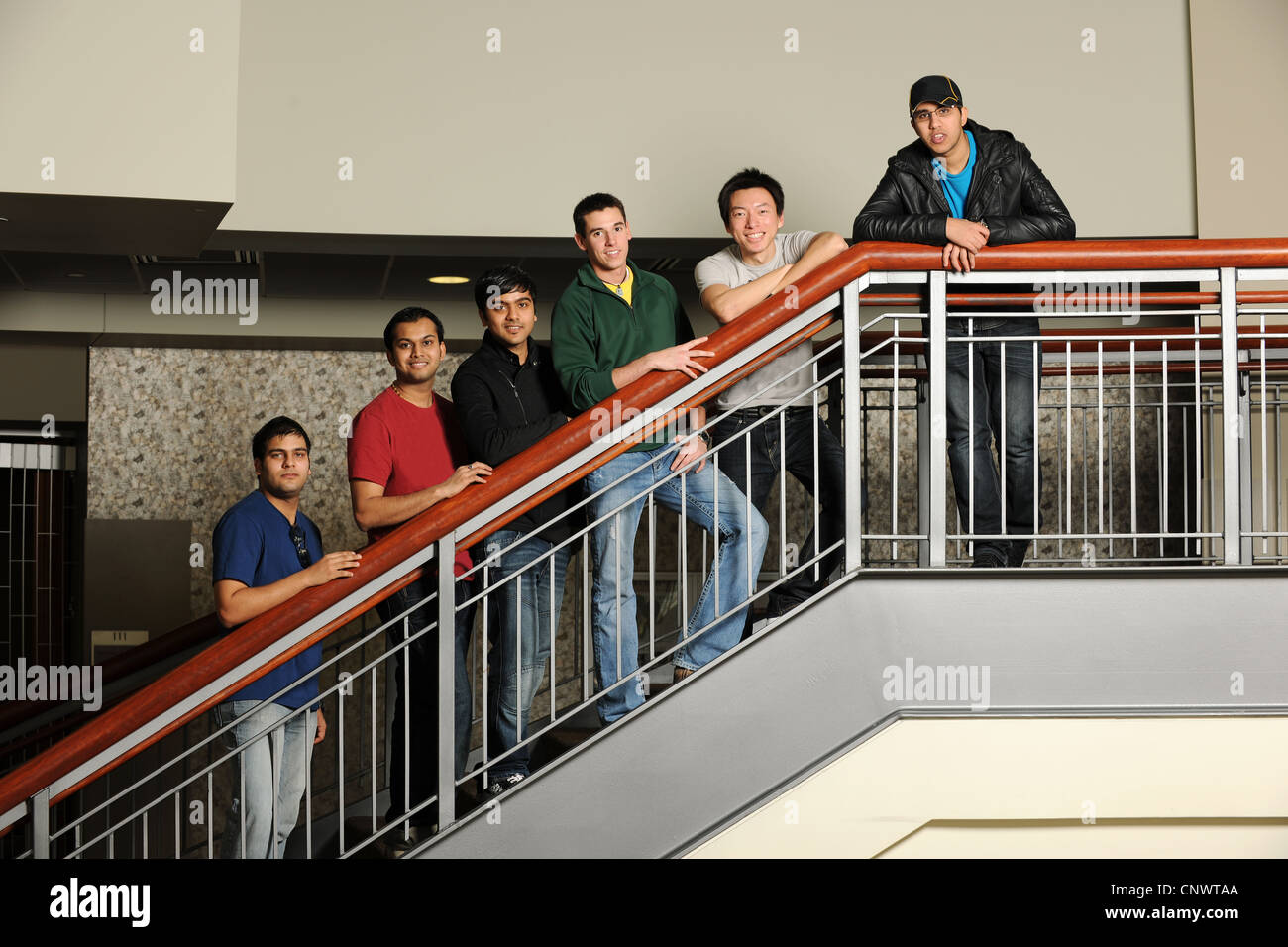 Group of Diverse College Students standing at the stairs inside a ...