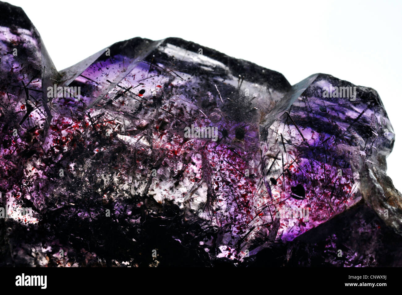 Amethyst with inclusions of rutile and haematite Stock Photo - Alamy