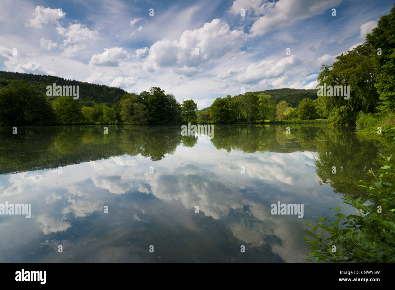 clouds reflecting in a lake, Germany, Saxony, Vogtland Stock Photo - Alamy