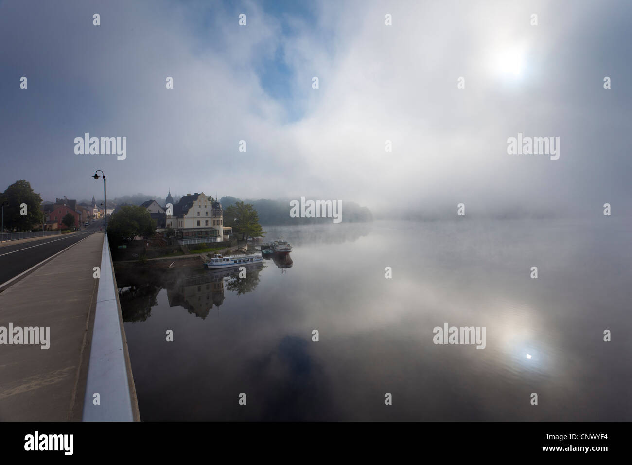 morning mist at lake Bleiloch with bridge and villa, Germany, Saxony ...
