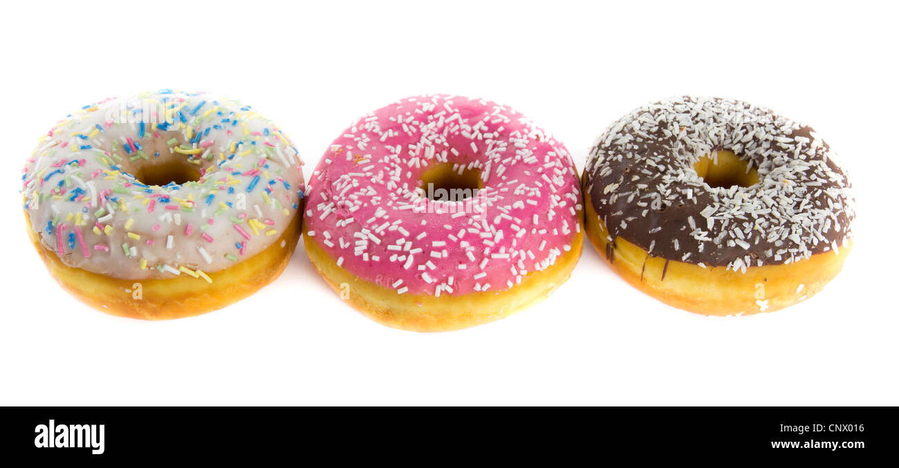 Picture of three donuts with chocolate, strawberry and vanilla frosting ...