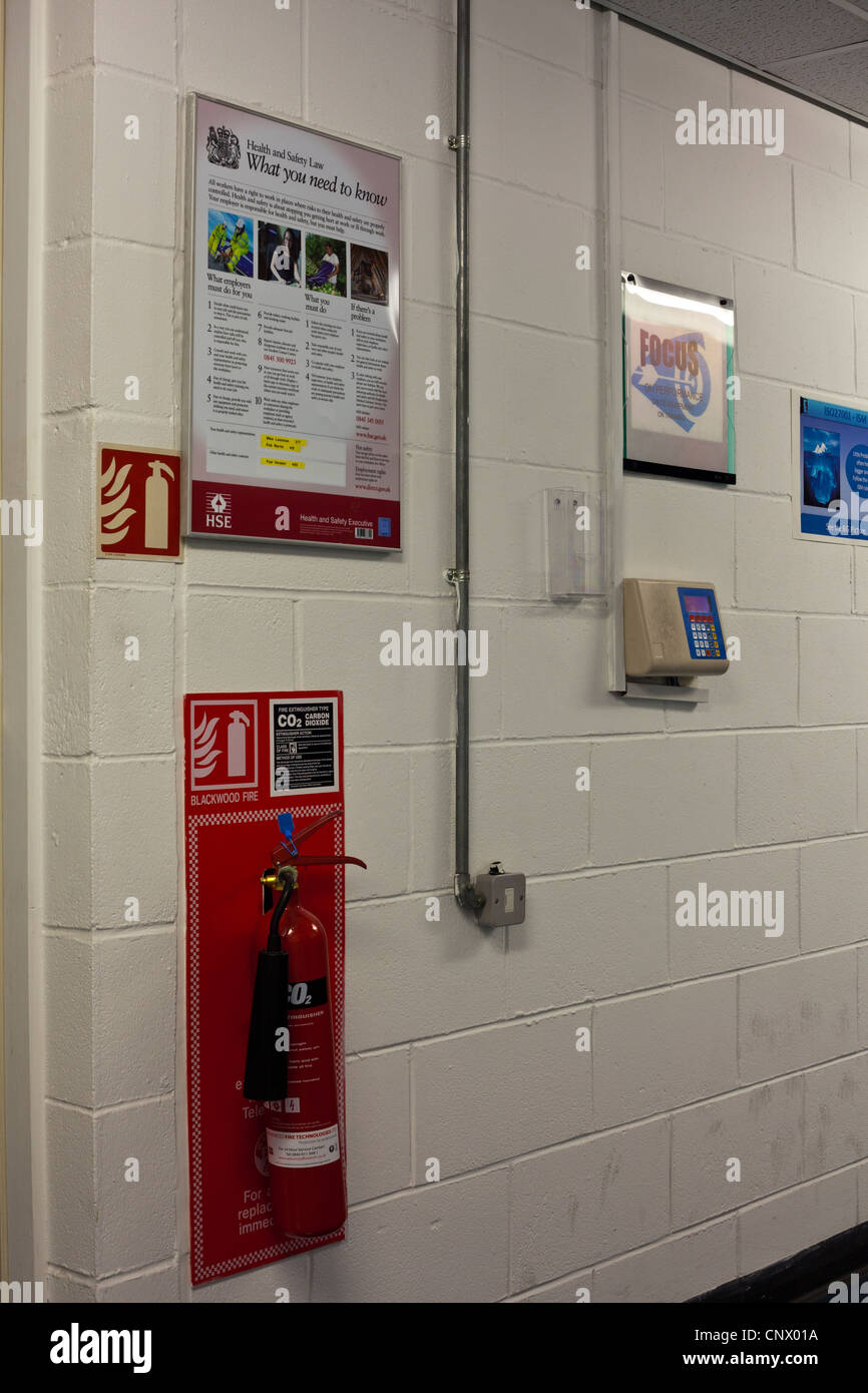 Fire point with extinguisher and fire alarms and exits Stock Photo - Alamy