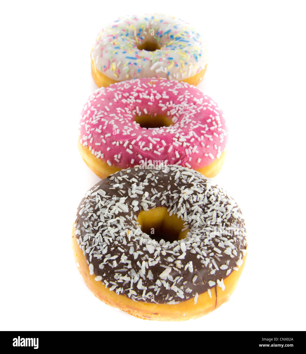 Picture of three donuts in a row on a white background Stock Photo - Alamy