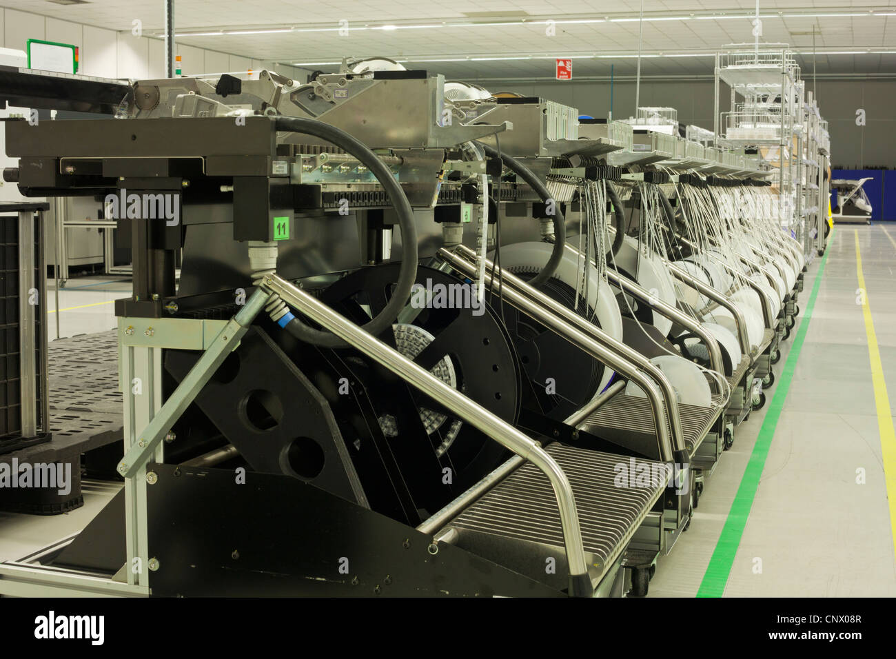 SMT SMD components loaded on feeders and placement machine carts ready ...