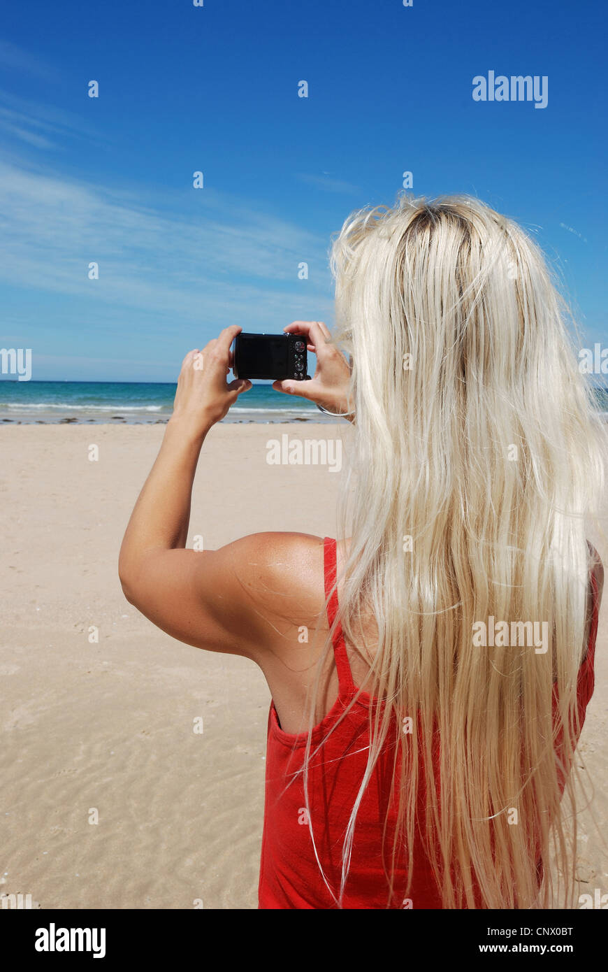 Woman taking picture Stock Photo - Alamy