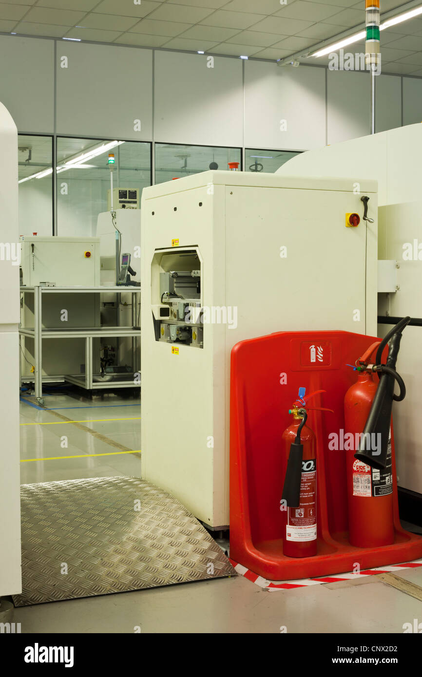 Fire point with extinguisher and fire alarms and exits Stock Photo - Alamy