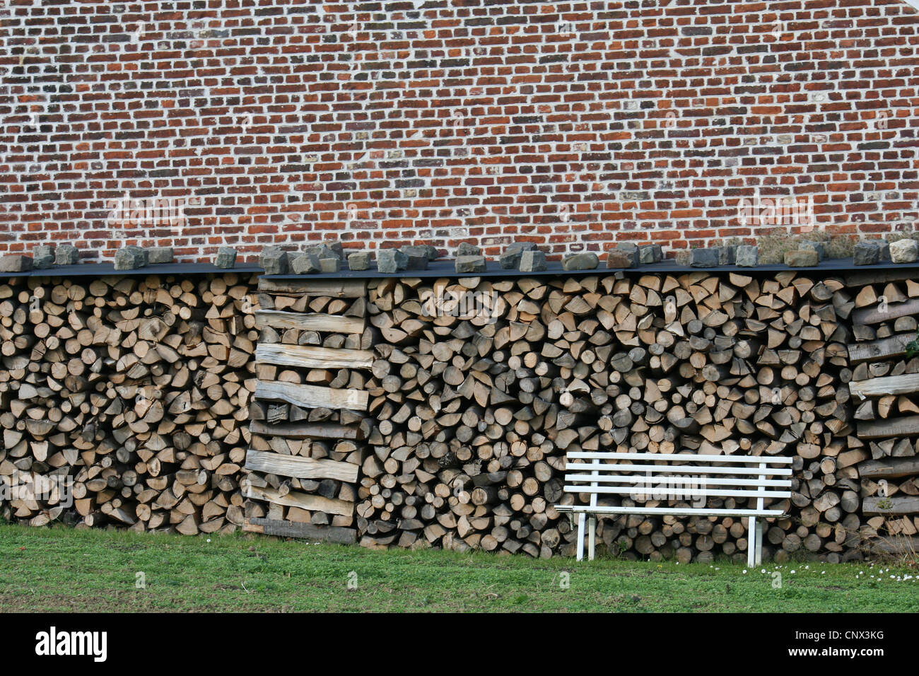 Logs and bricks Stock Photo - Alamy