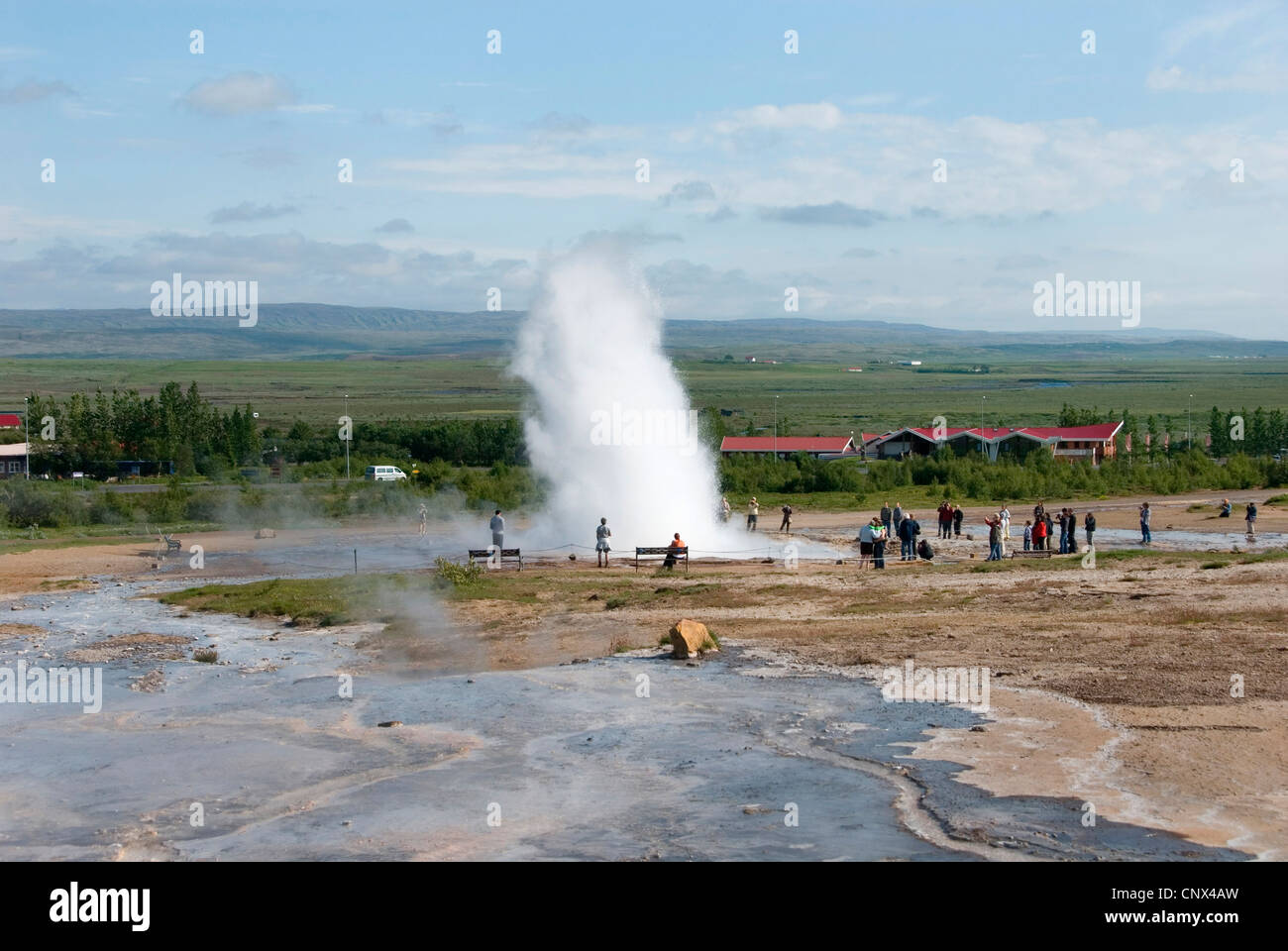 people at the water columns of Stokkur geyser, Iceland, Haukadalur ...