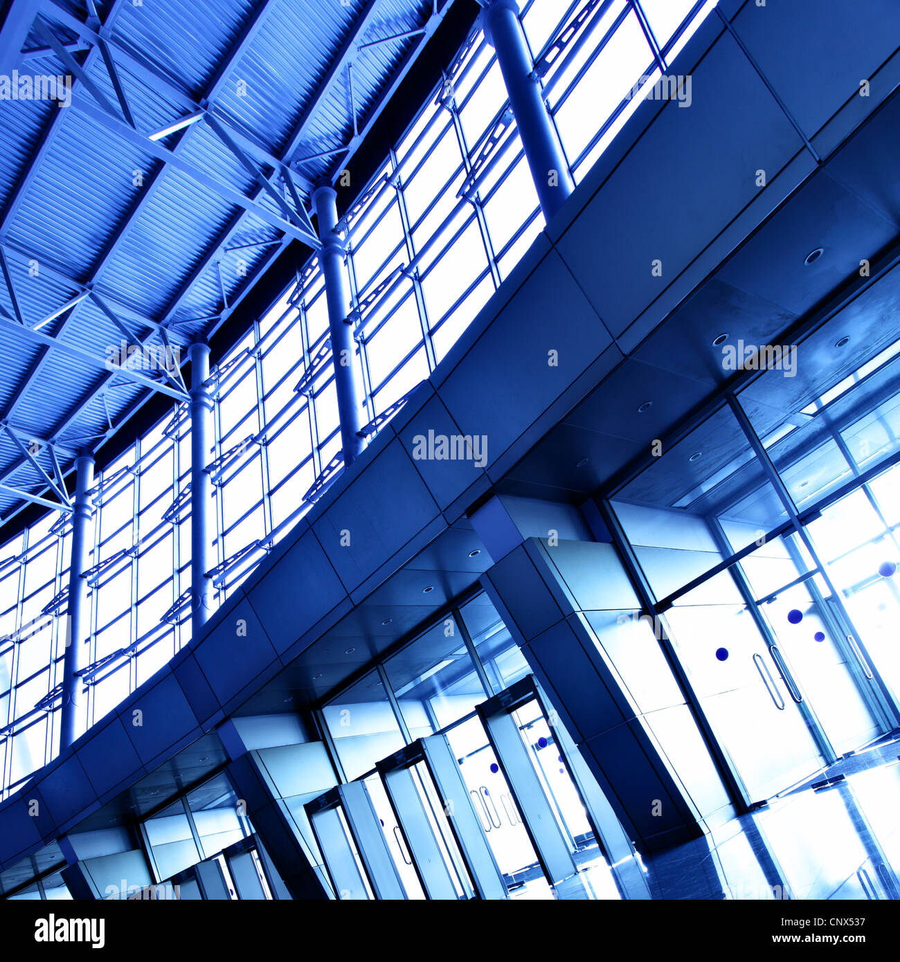 Modern interior of office building, toned in blue color Stock Photo - Alamy