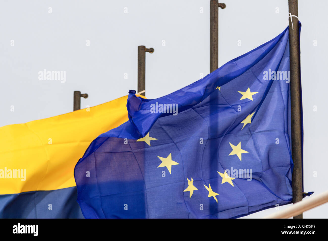 europe flag in grey sky Stock Photo - Alamy