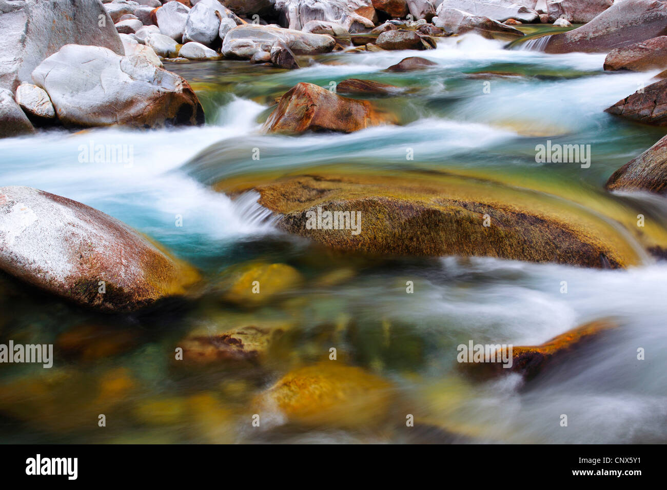 river Verzasca running over boulders through the Valle Verzasca ...