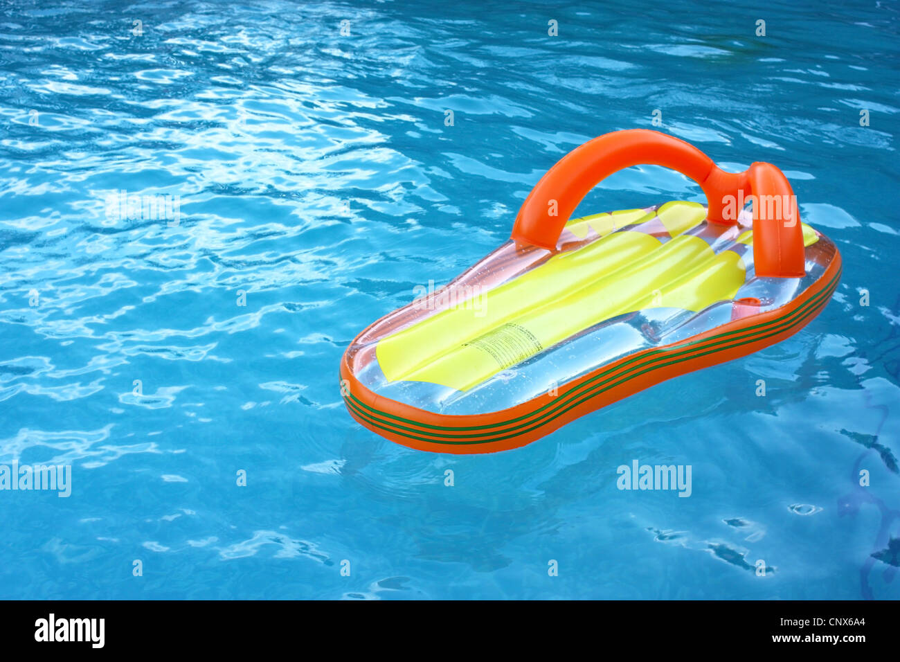 A float inside swimming pool water Stock Photo - Alamy