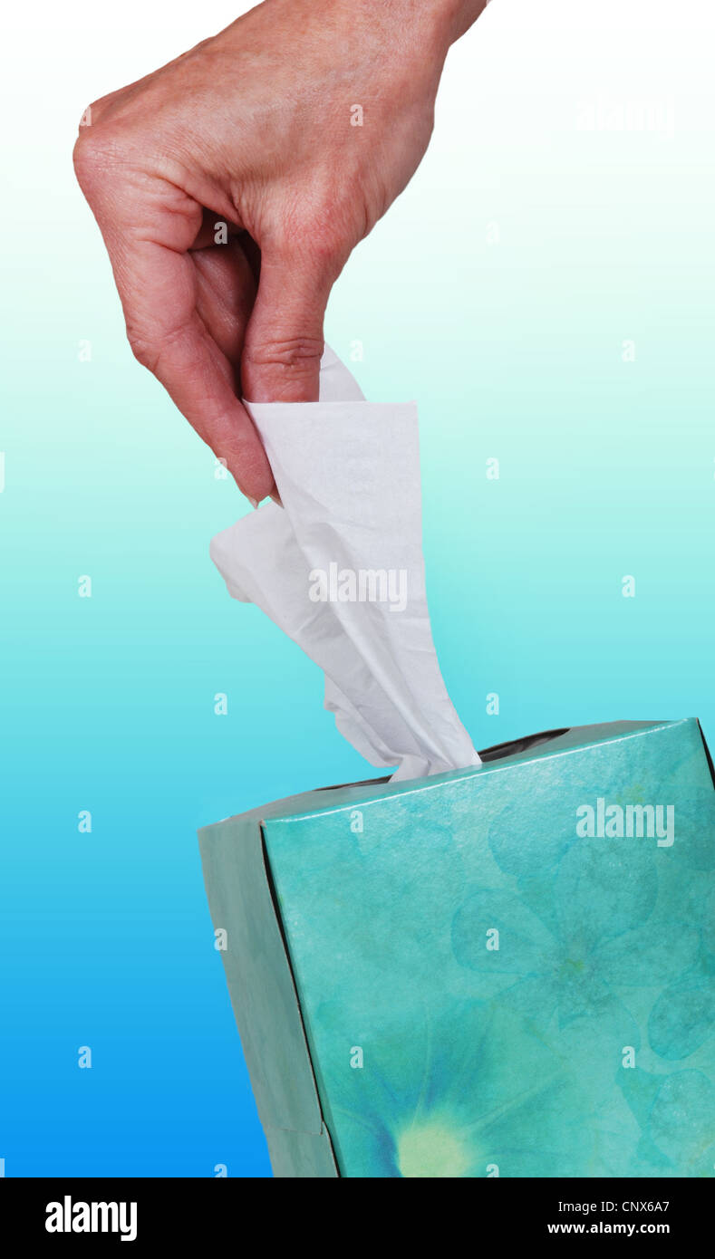Hand pulling tissue out of box Stock Photo - Alamy