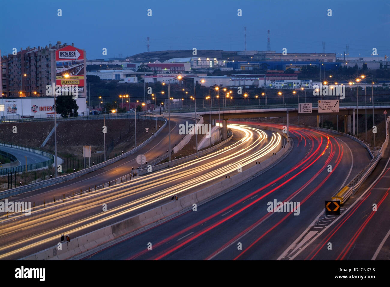Traffic on a motorway at night Stock Photo - Alamy