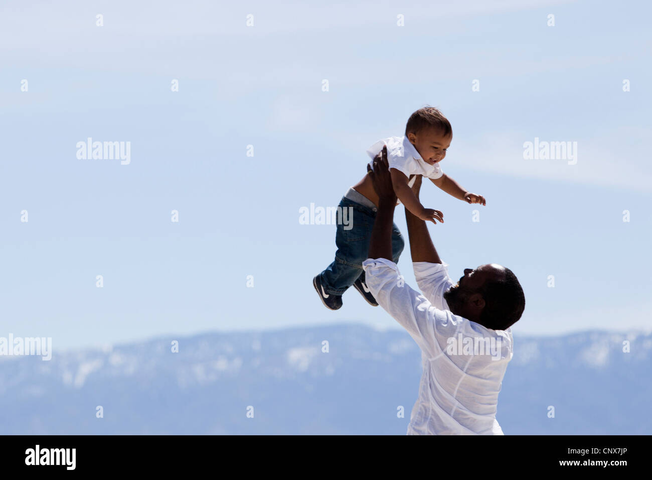 Father and son playing in the desert Stock Photo - Alamy