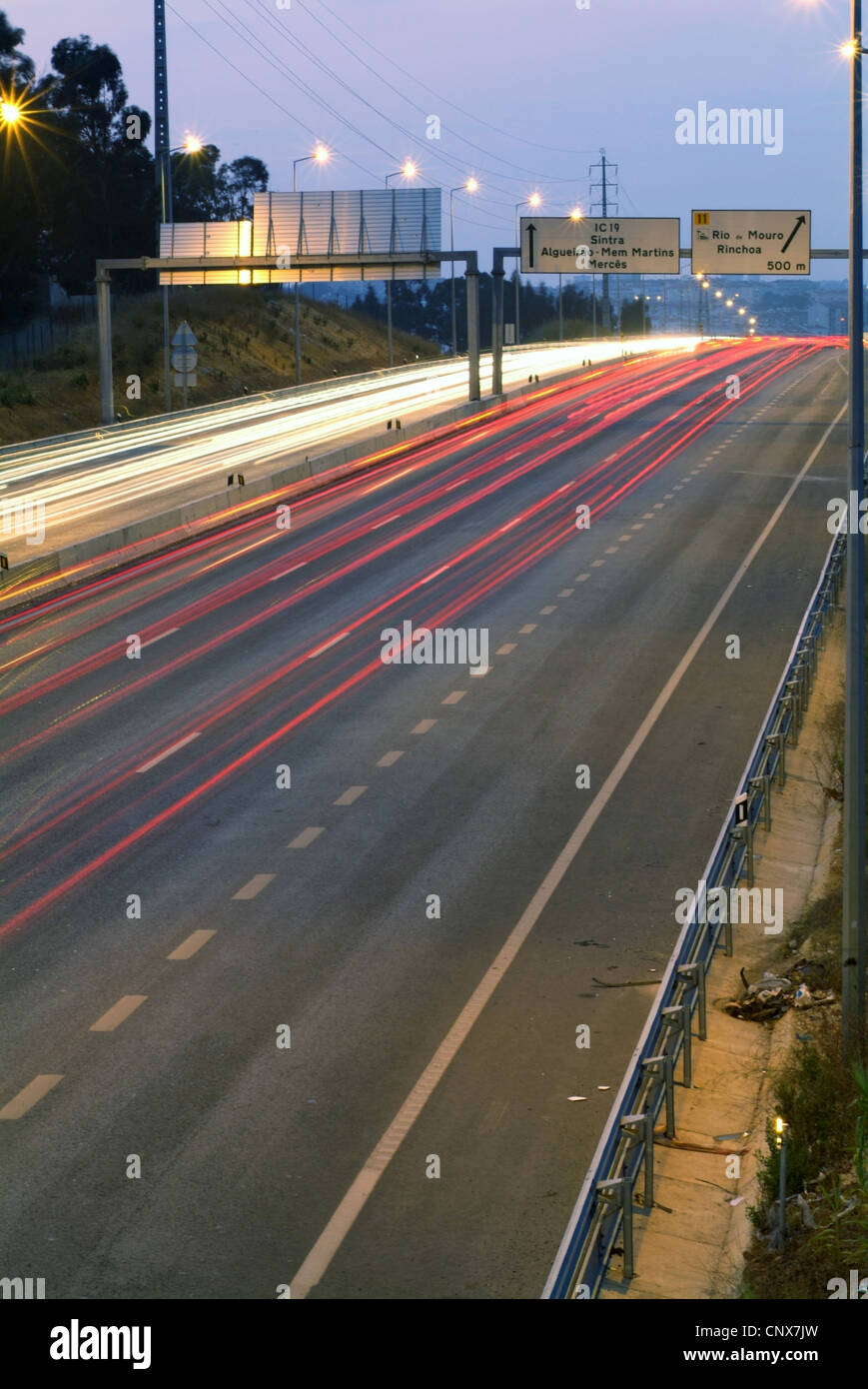 Traffic on a motorway at night Stock Photo - Alamy