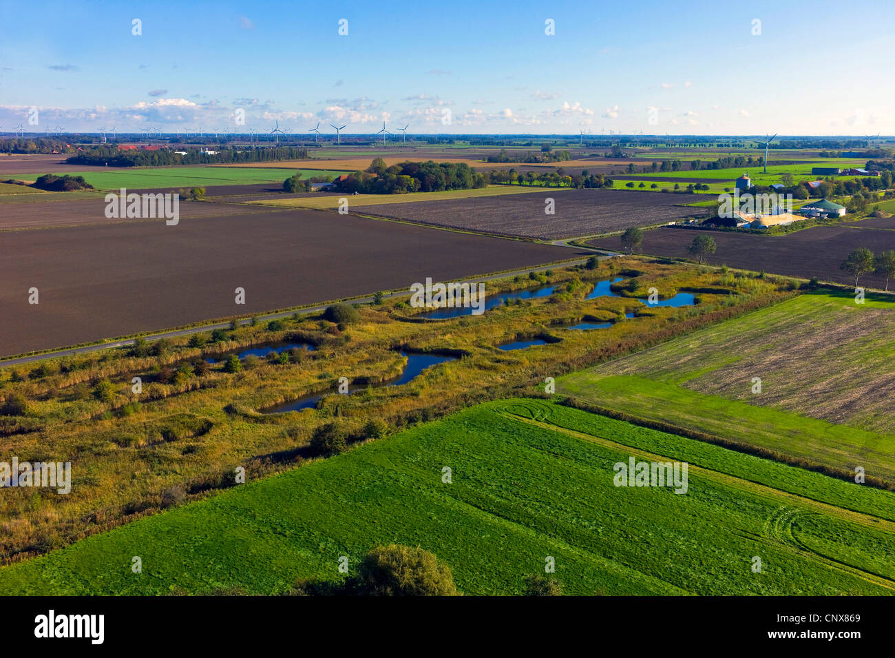 view at the meadows and fields behind the dyke from the highest German ...