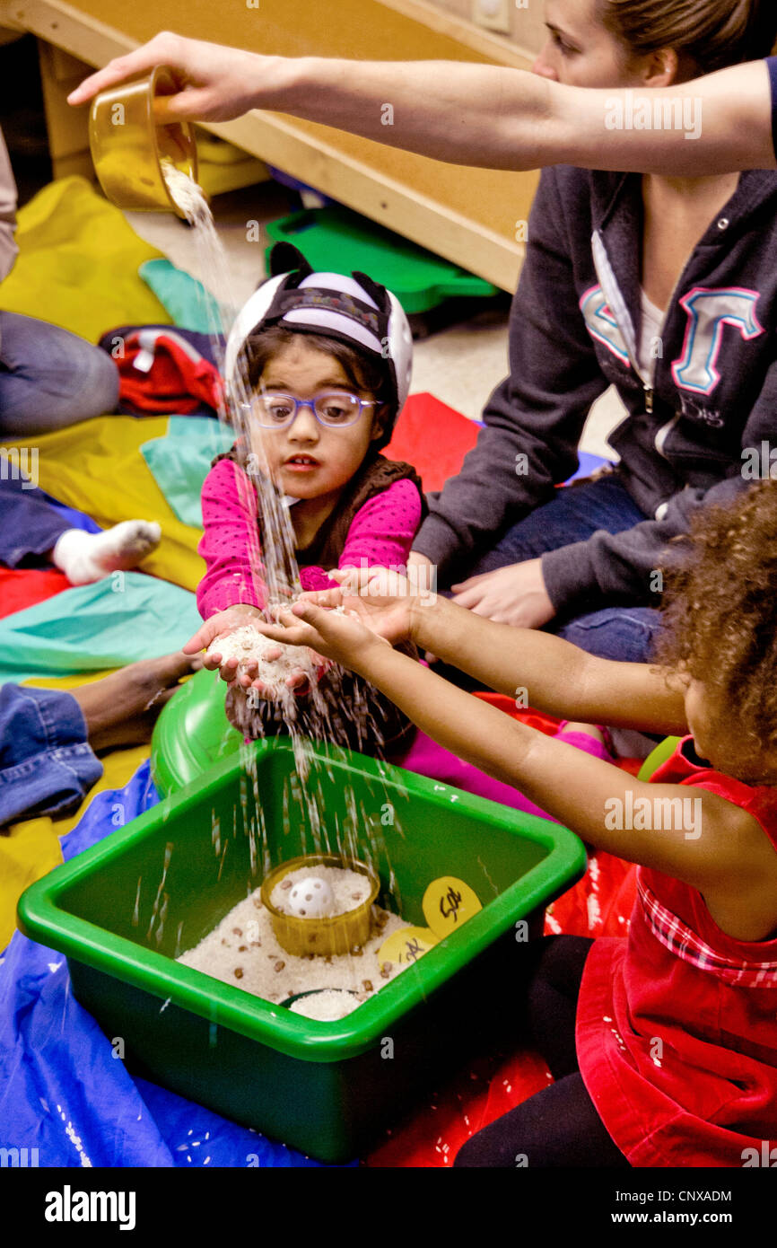 Blind and vision-impaired children sift sand to improve their tactile ...
