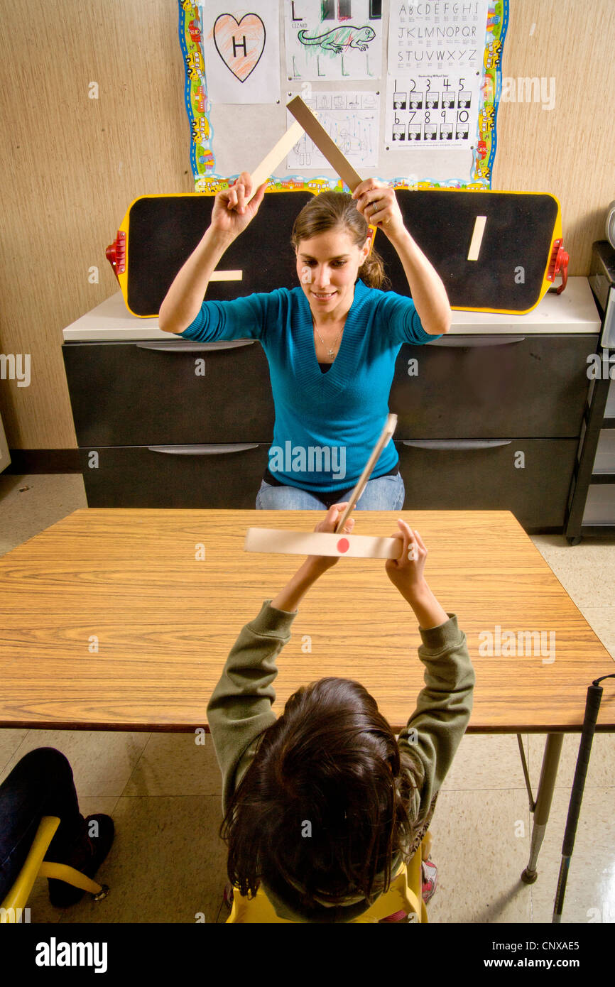 The teacher in a special needs pre-Braille writing class at the Blind ...