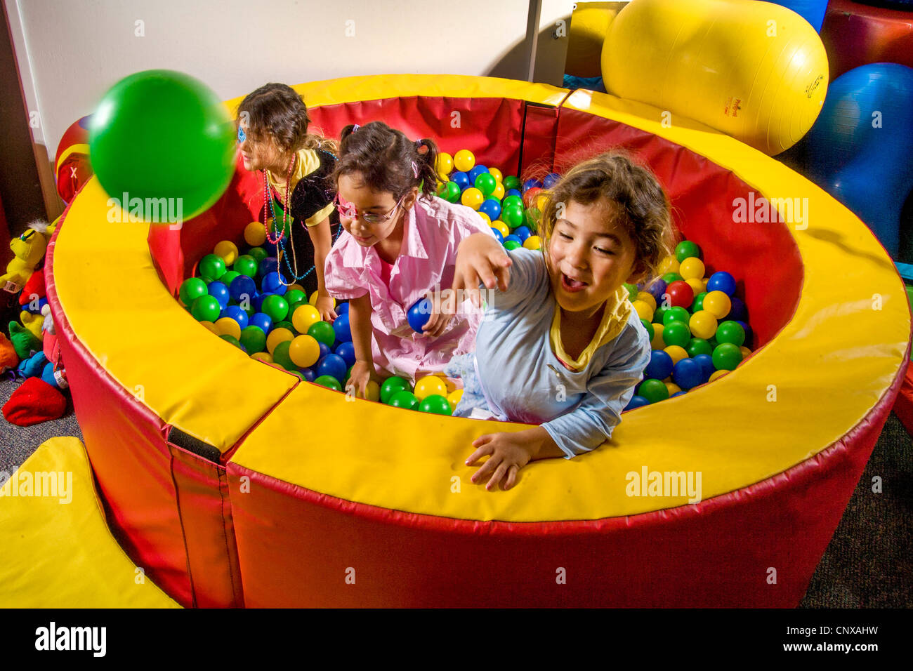 Partially blind girls toss plastic balls during an occupational skills ...