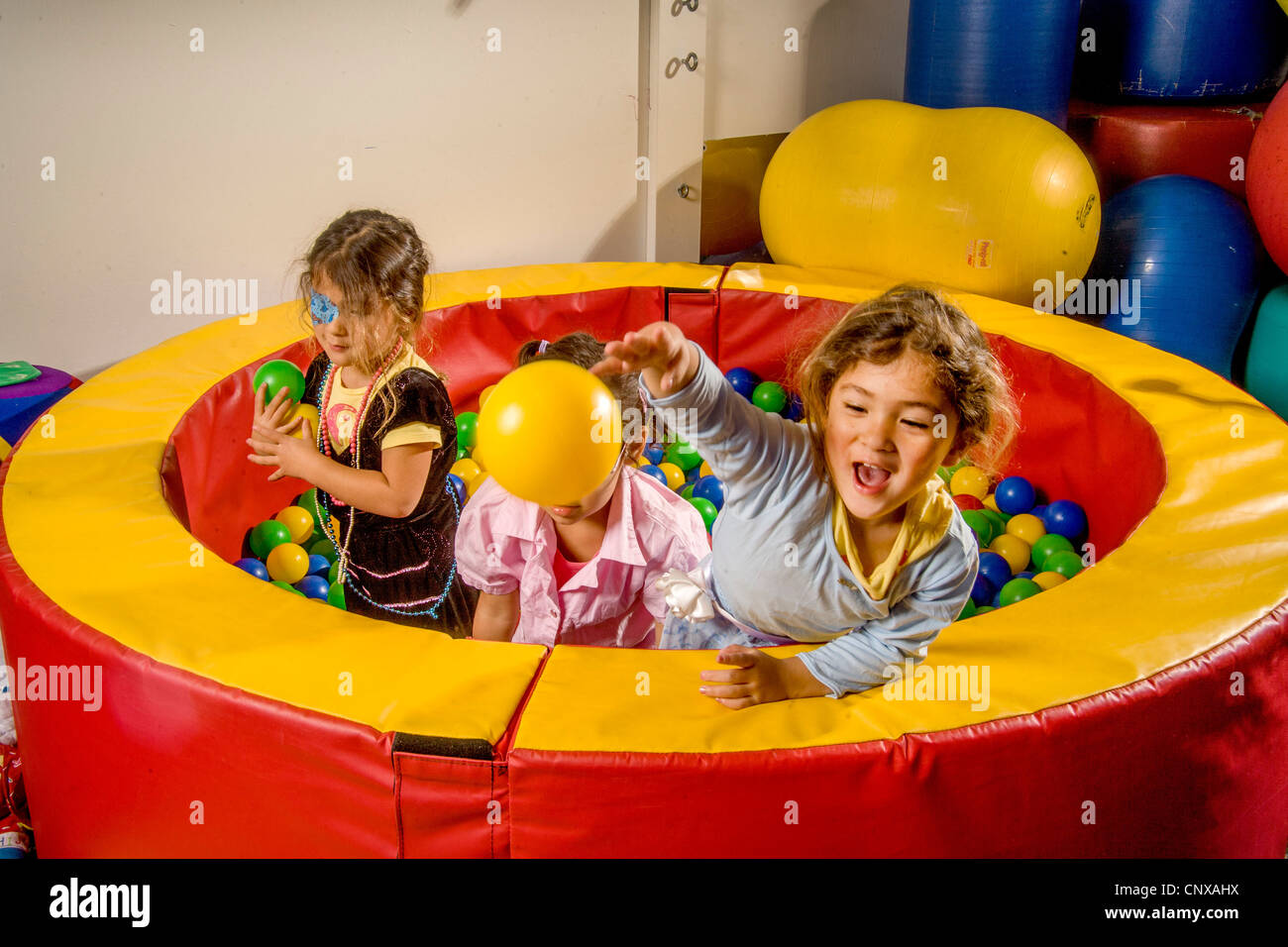 Partially blind girls toss plastic balls during an occupational skills ...