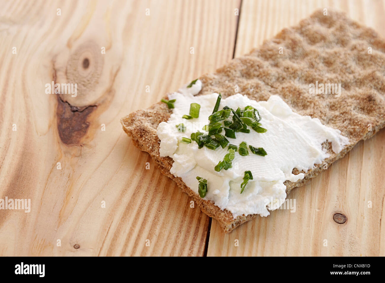 Whole grain bread with curd and chives Stock Photo - Alamy