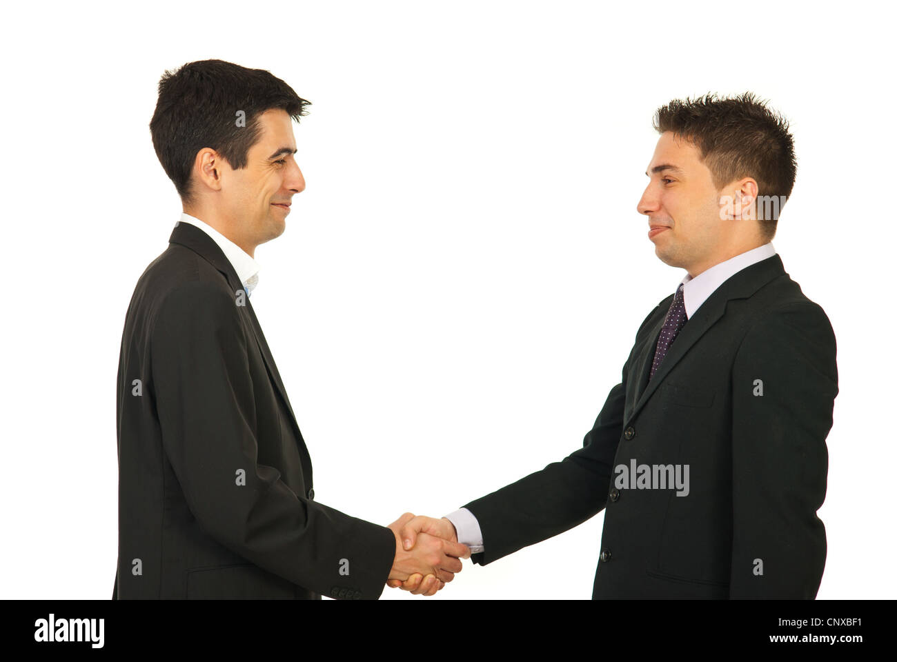 Happy two business men giving hand shake and smiling isolated on white ...