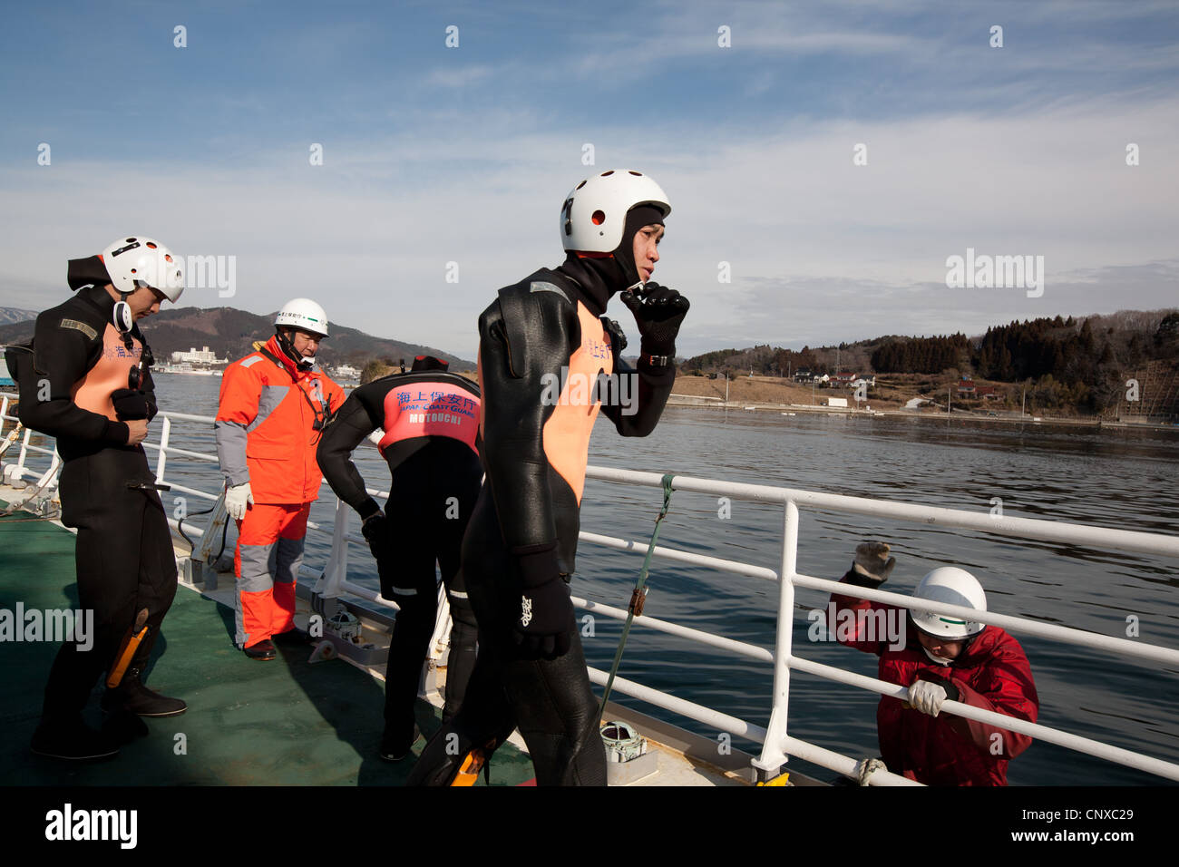 Japanese coast guard search underwater for the bodies of victims of the ...