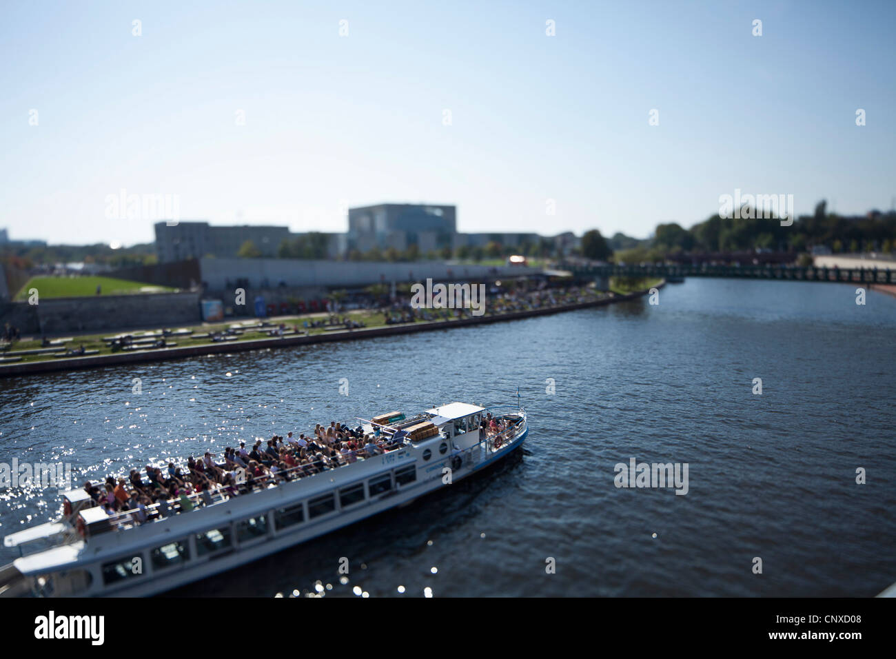 A tour boat on the Spree River, Germany, tilt-shift Stock Photo - Alamy