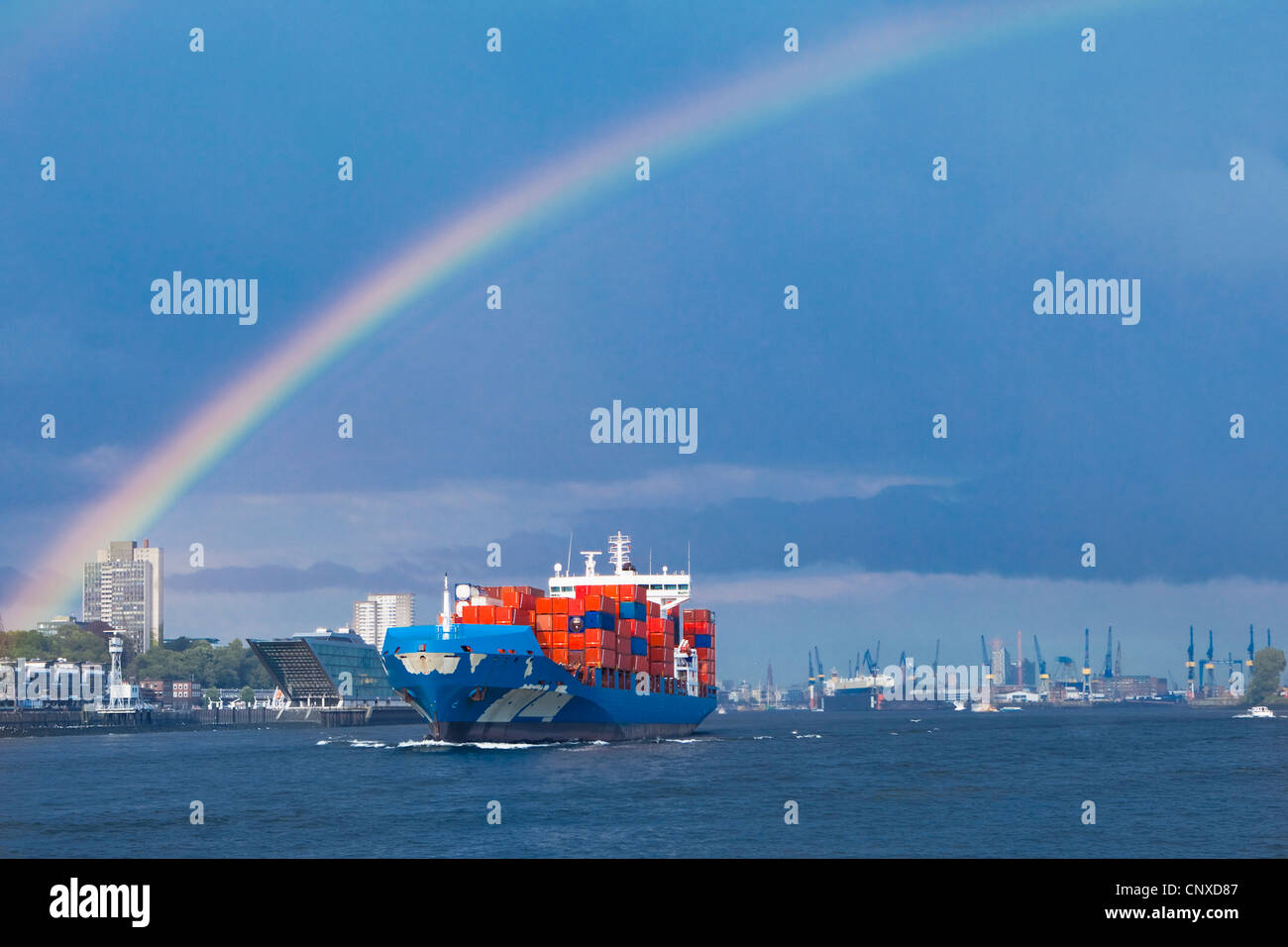 A rainbow over a shipping container in the Hamburg harbor Stock Photo ...