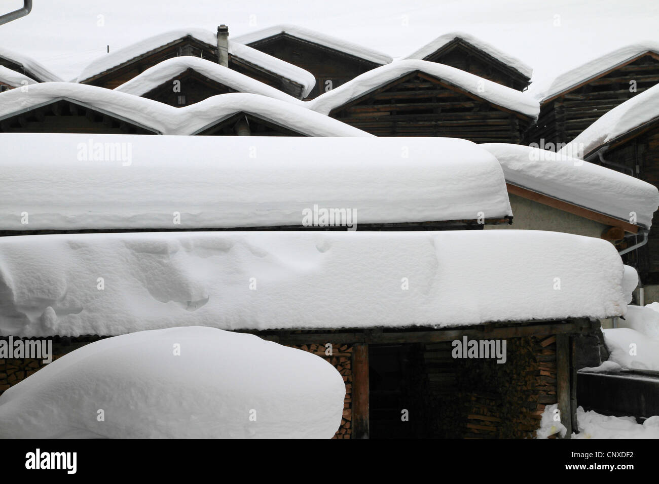 Patterns of snow-capped cabins Stock Photo - Alamy