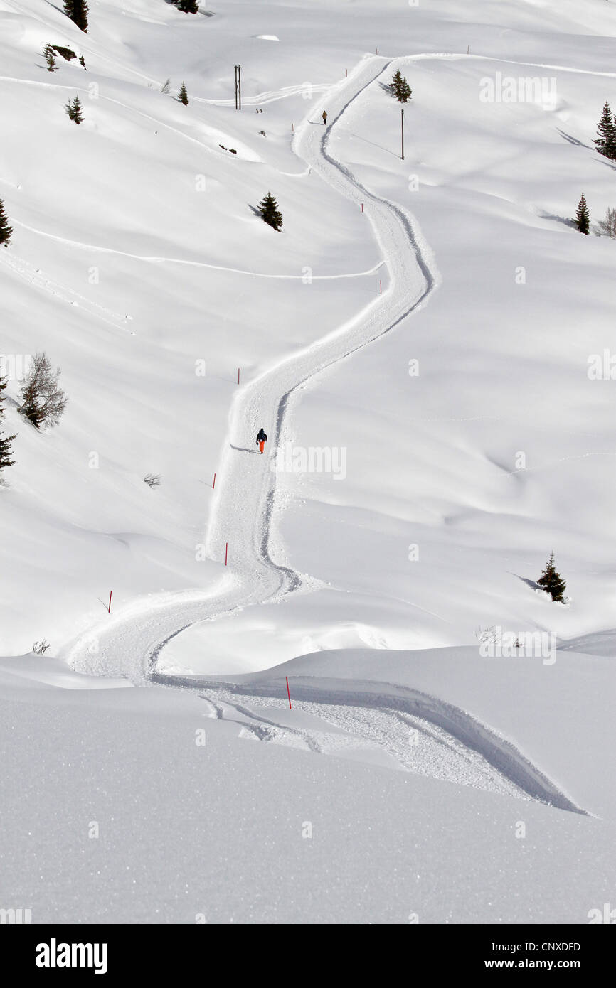 Curved snow path over hills Stock Photo - Alamy