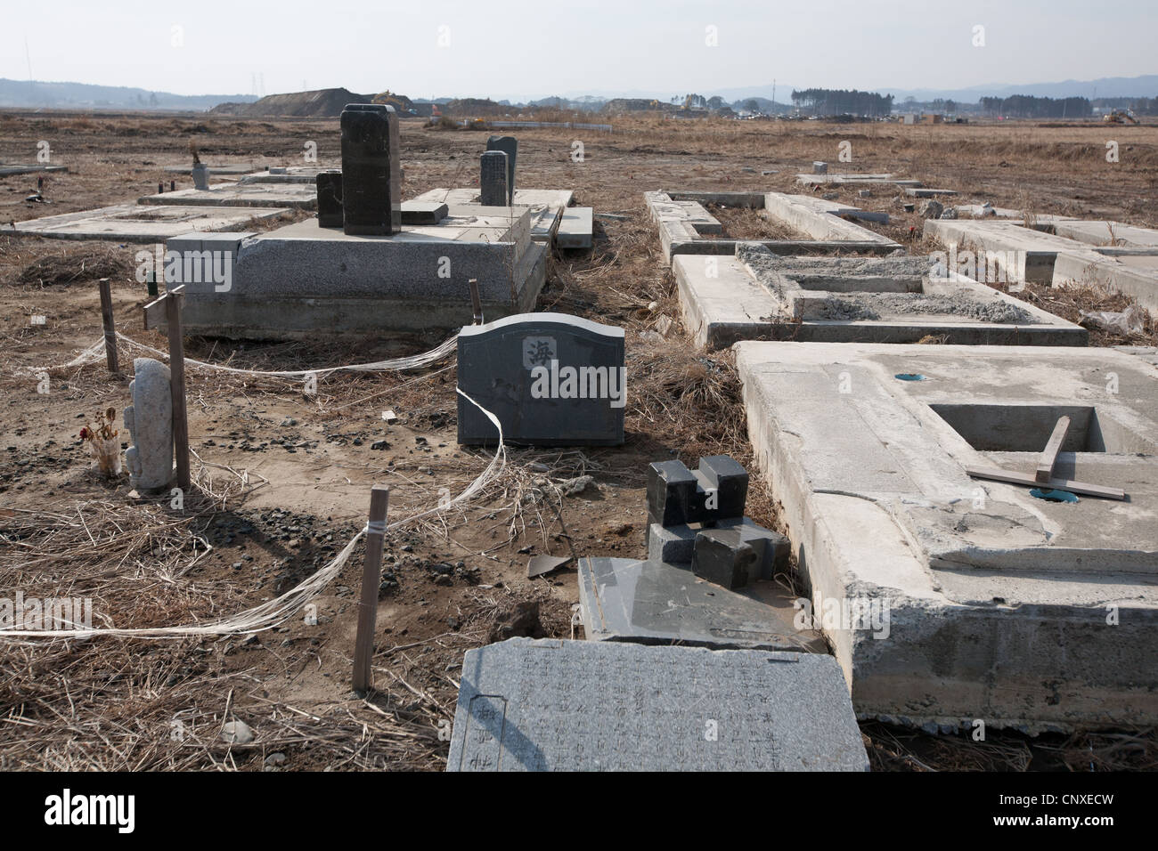 Graves in the tsunami-hit zone of Minami-Soma town, in Tohoku, Japan ...