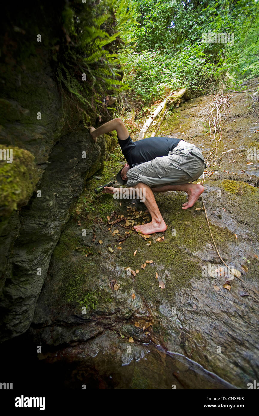 Stooping man looking down hi-res stock photography and images - Alamy