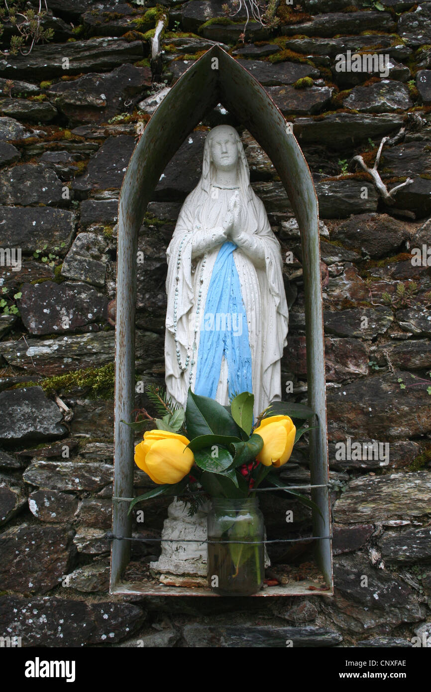 Catholic shrine with flowers Stock Photo - Alamy