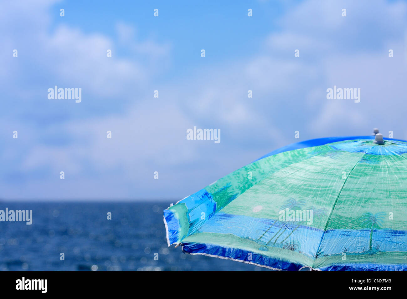 Beach umbrella close up against a sea landscape Stock Photo - Alamy