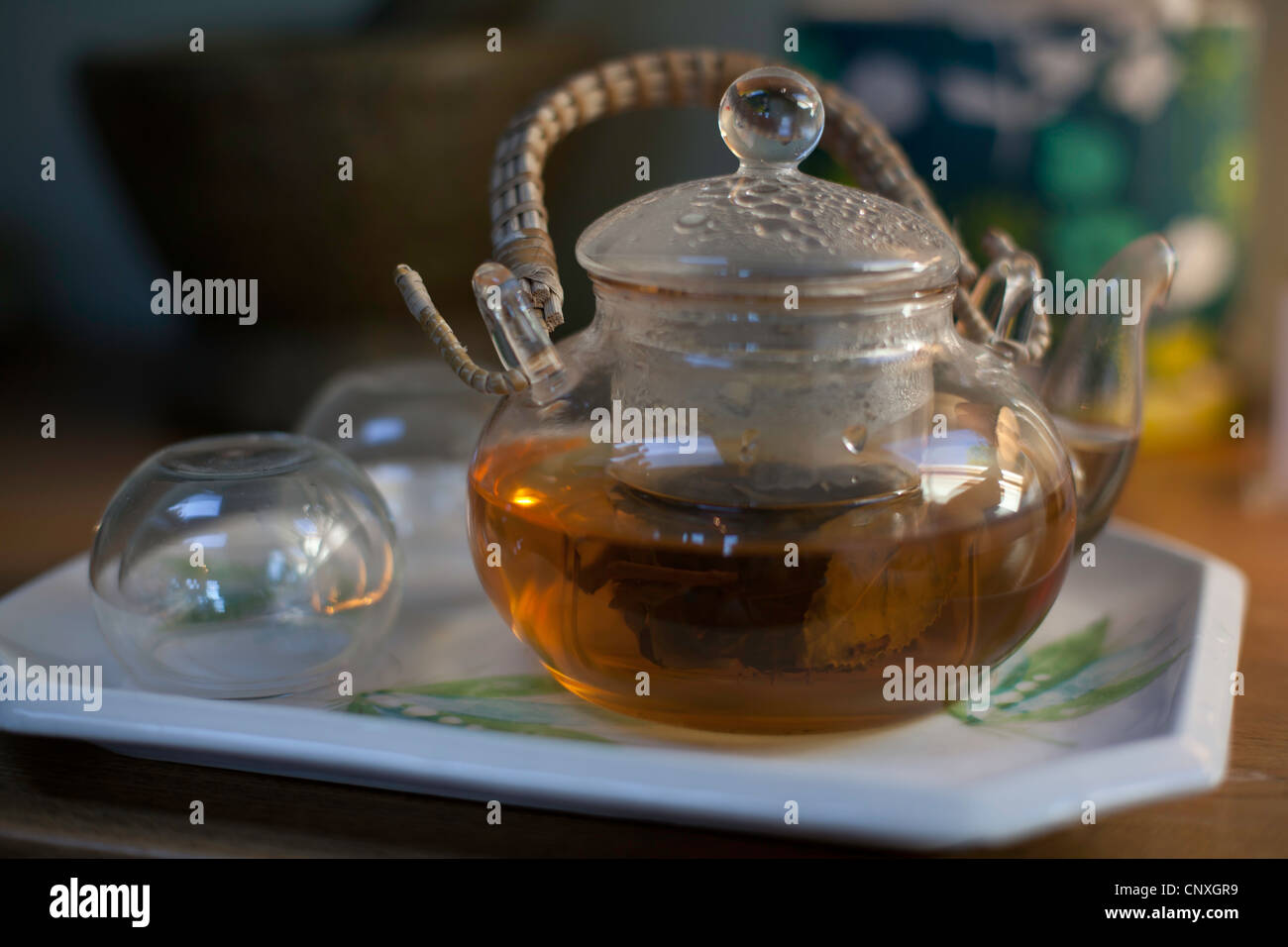 Tea pot with tea cosy hi-res stock photography and images - Alamy