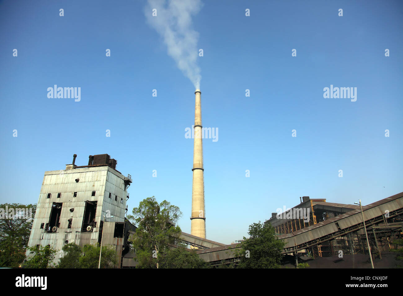 Factory chimney releasing steam Stock Photo - Alamy