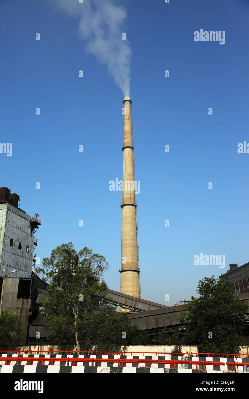Factory chimney releasing steam Stock Photo - Alamy