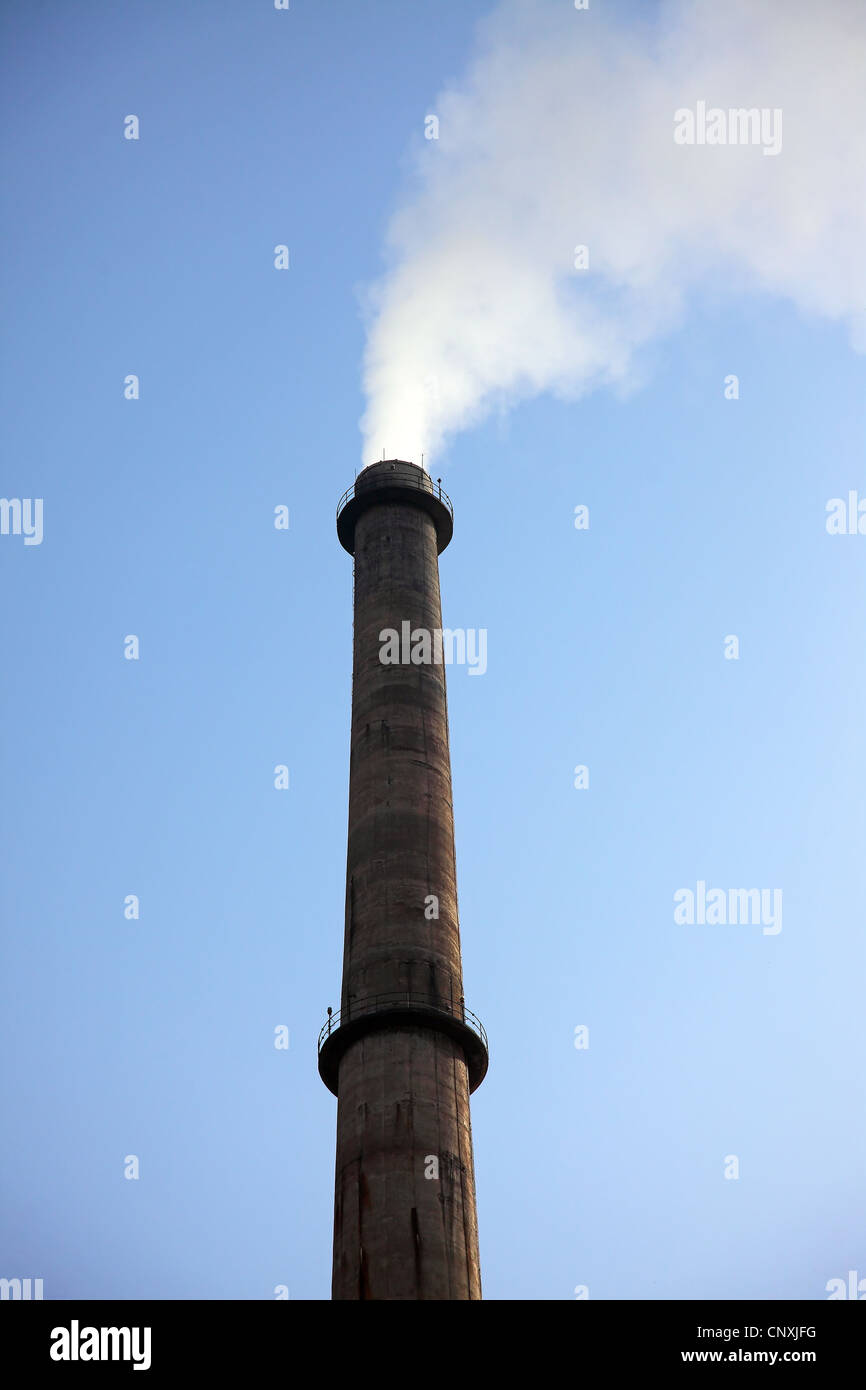 Factory chimney releasing steam Stock Photo - Alamy