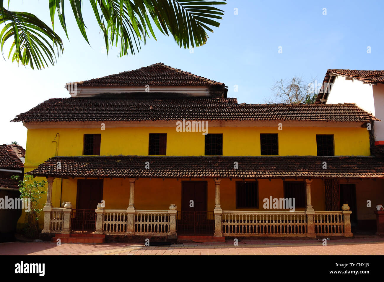 An Indian yellow traditional yellow home from village Goa,India Stock ...