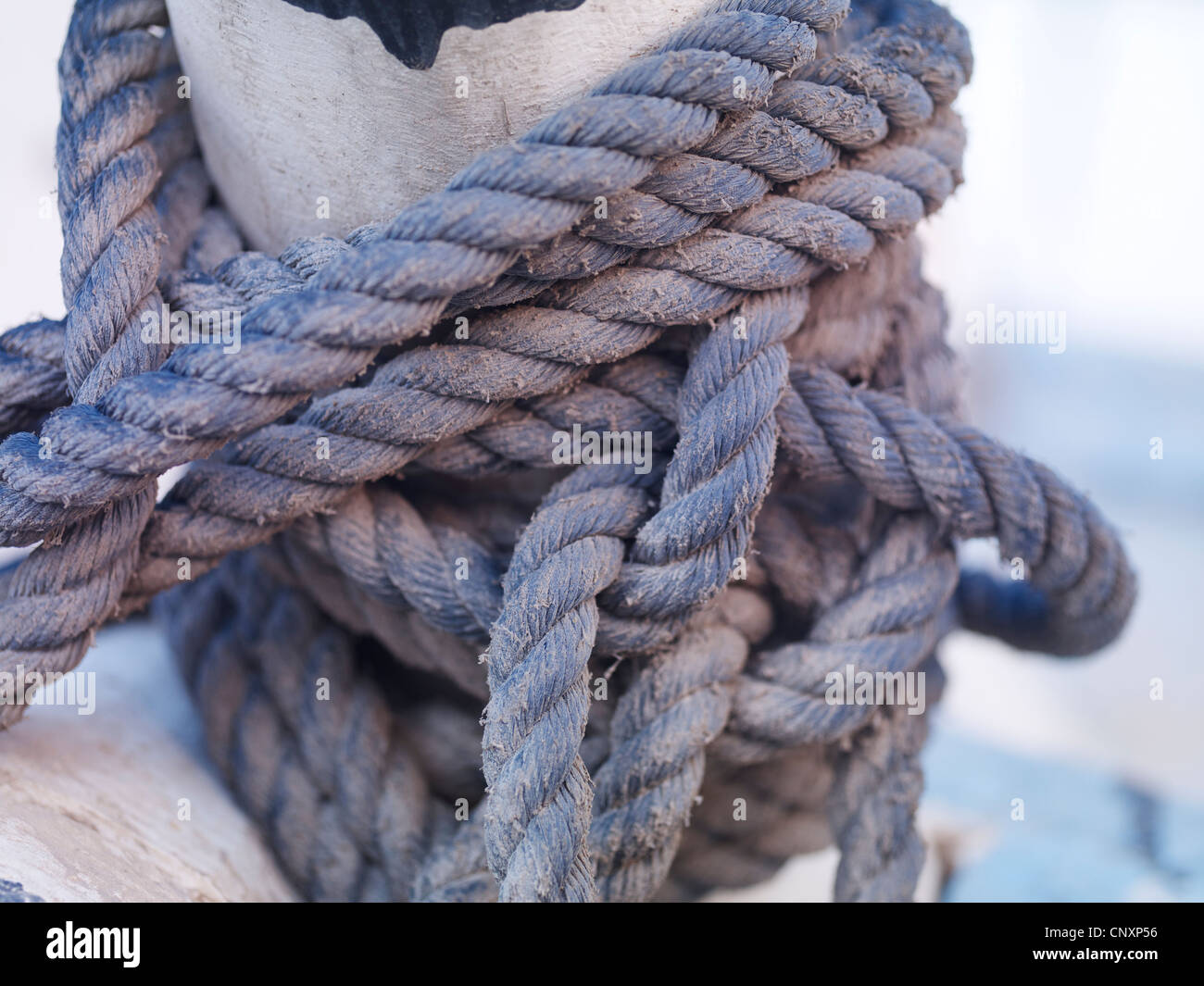 blue rope tied to a bollard Stock Photo - Alamy