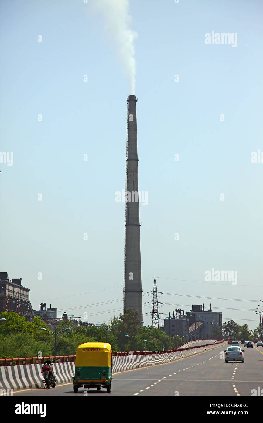 Factory chimney releasing steam Stock Photo - Alamy